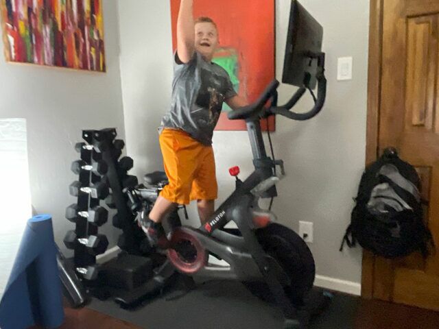How the Peloton Bike Helps Our Son with Down Syndrome Exercise